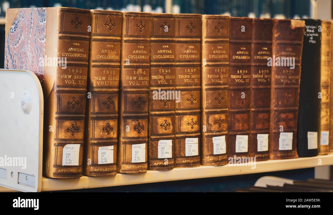 a collection of cyclopedia books placed on a library shelf Stock Photo ...