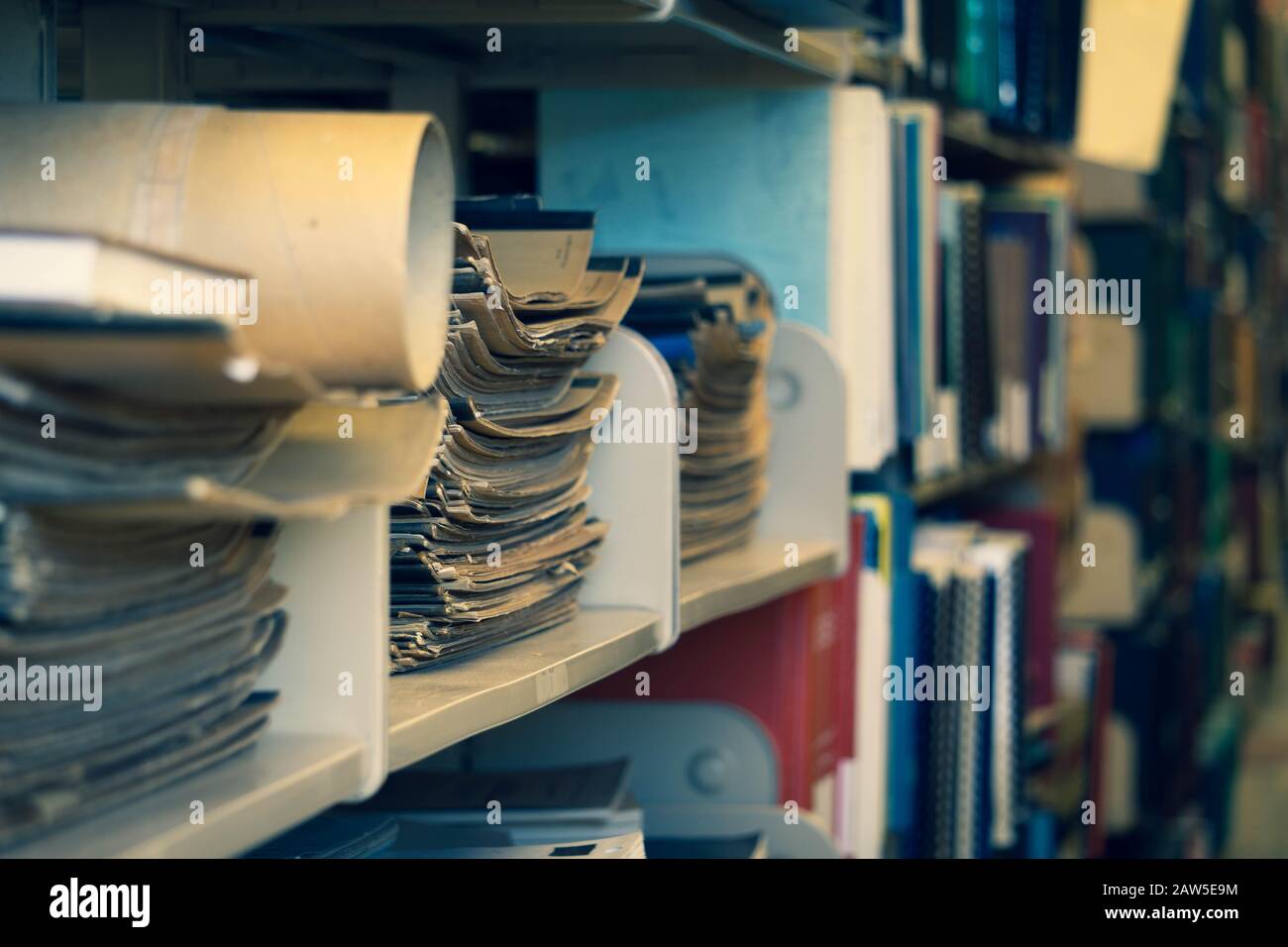 a stack of magazines on a library shelf Stock Photo - Alamy