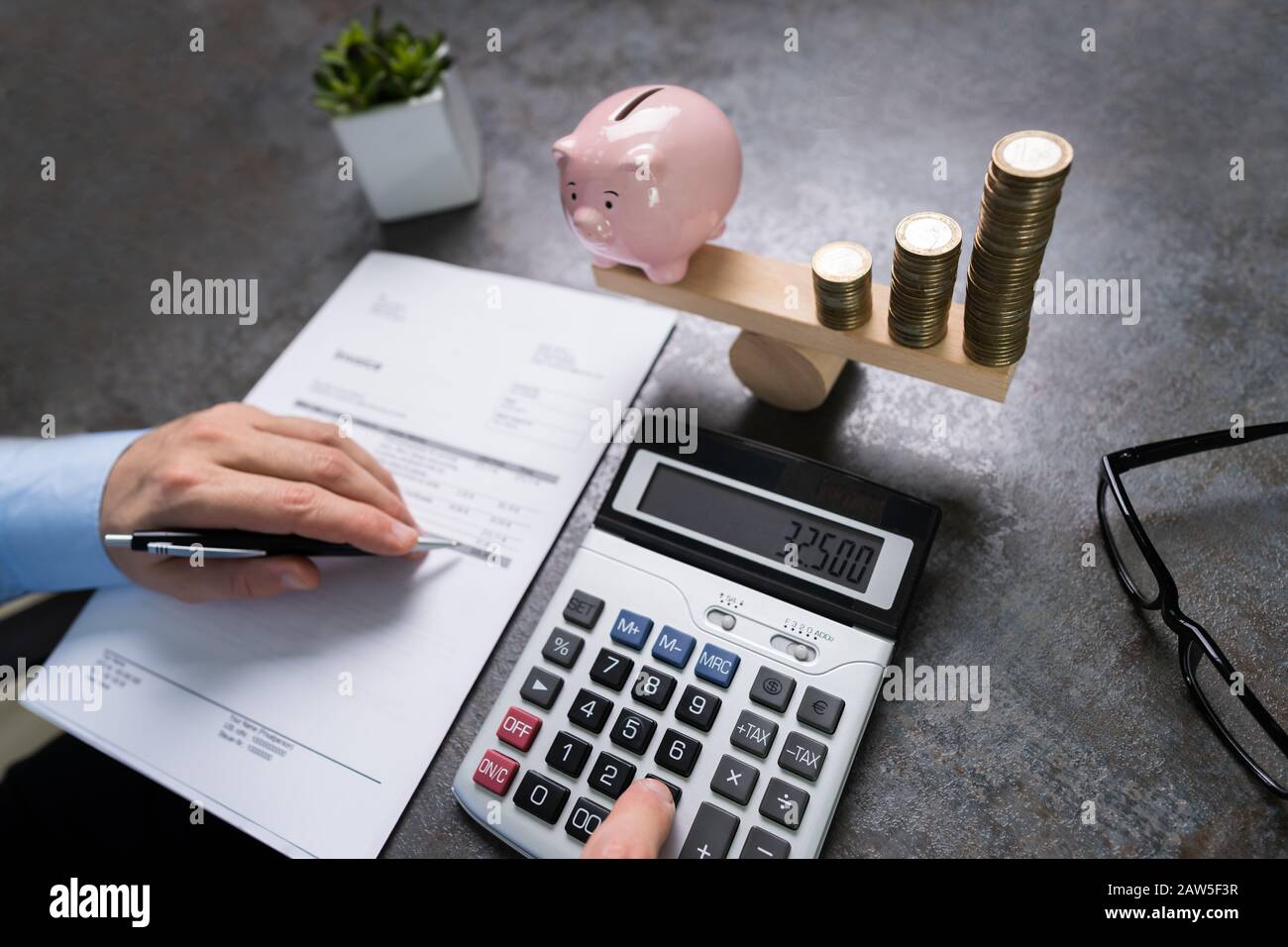 Man Calculating Bill Near Pink Piggybank And Increasing Stacked Coins ...