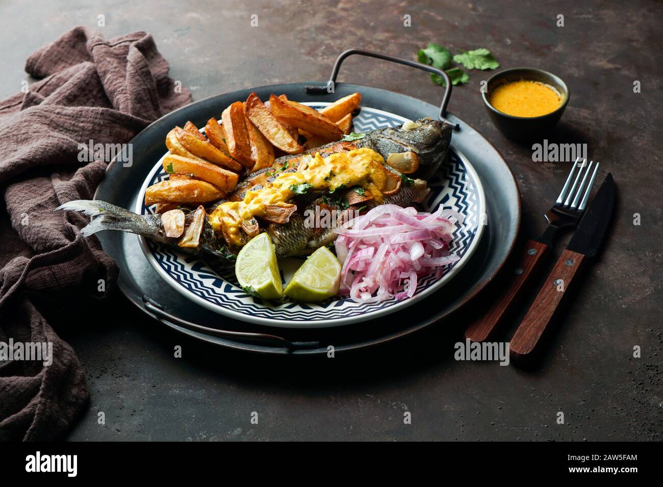 Chita frita al ajo, al ajillo, Peruvian food, a whole fish, served wit ...