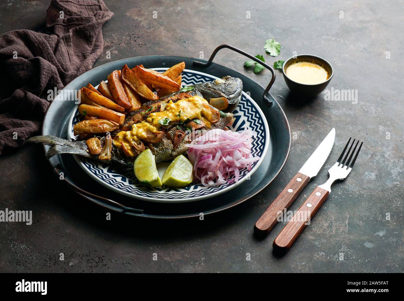 Chita frita al ajo, al ajillo, Peruvian food, a whole fish, served wit ...