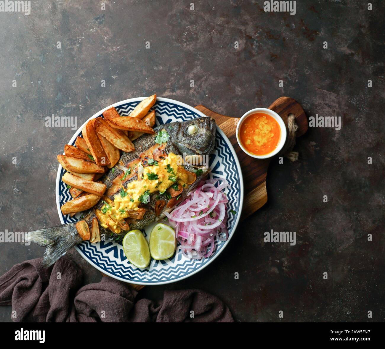 Chita frita al ajo, al ajillo, Peruvian food, a whole fish, served wit ...