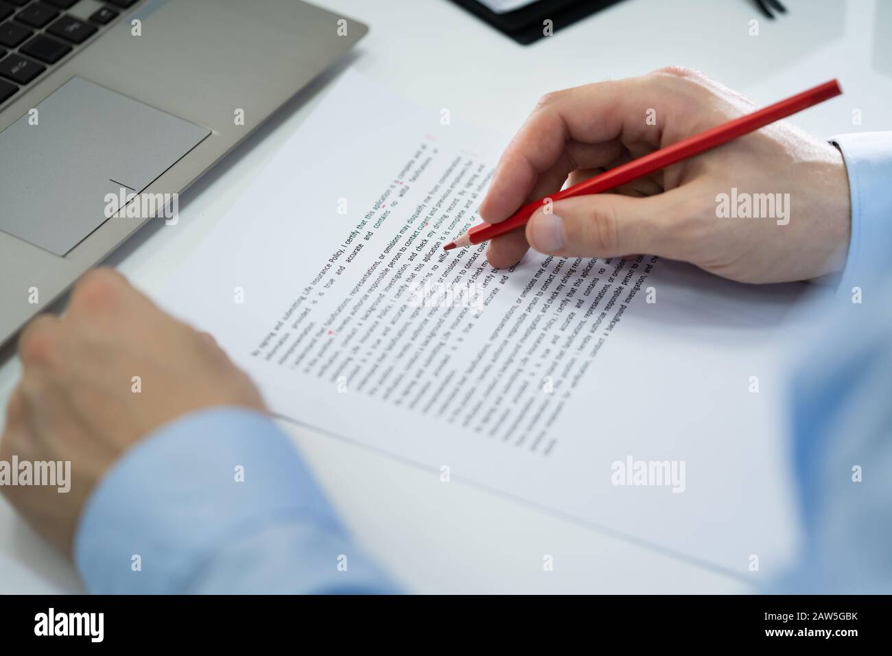 Close-up Of Red Pencil Marking Error During Spellchecking Text On Paper ...