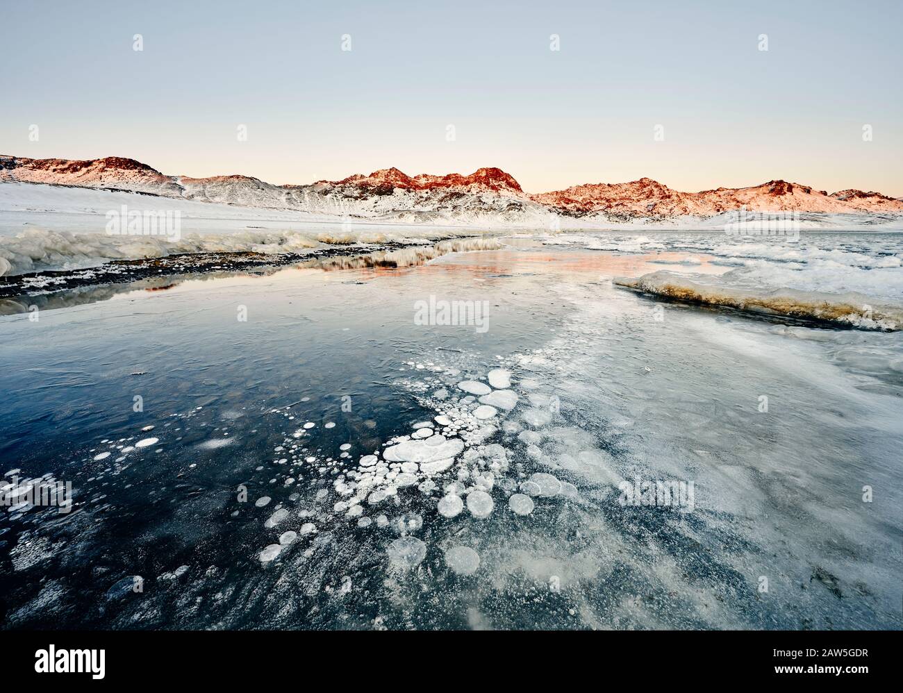 Coastline in covered with snow and ice natural landscape by lake ...
