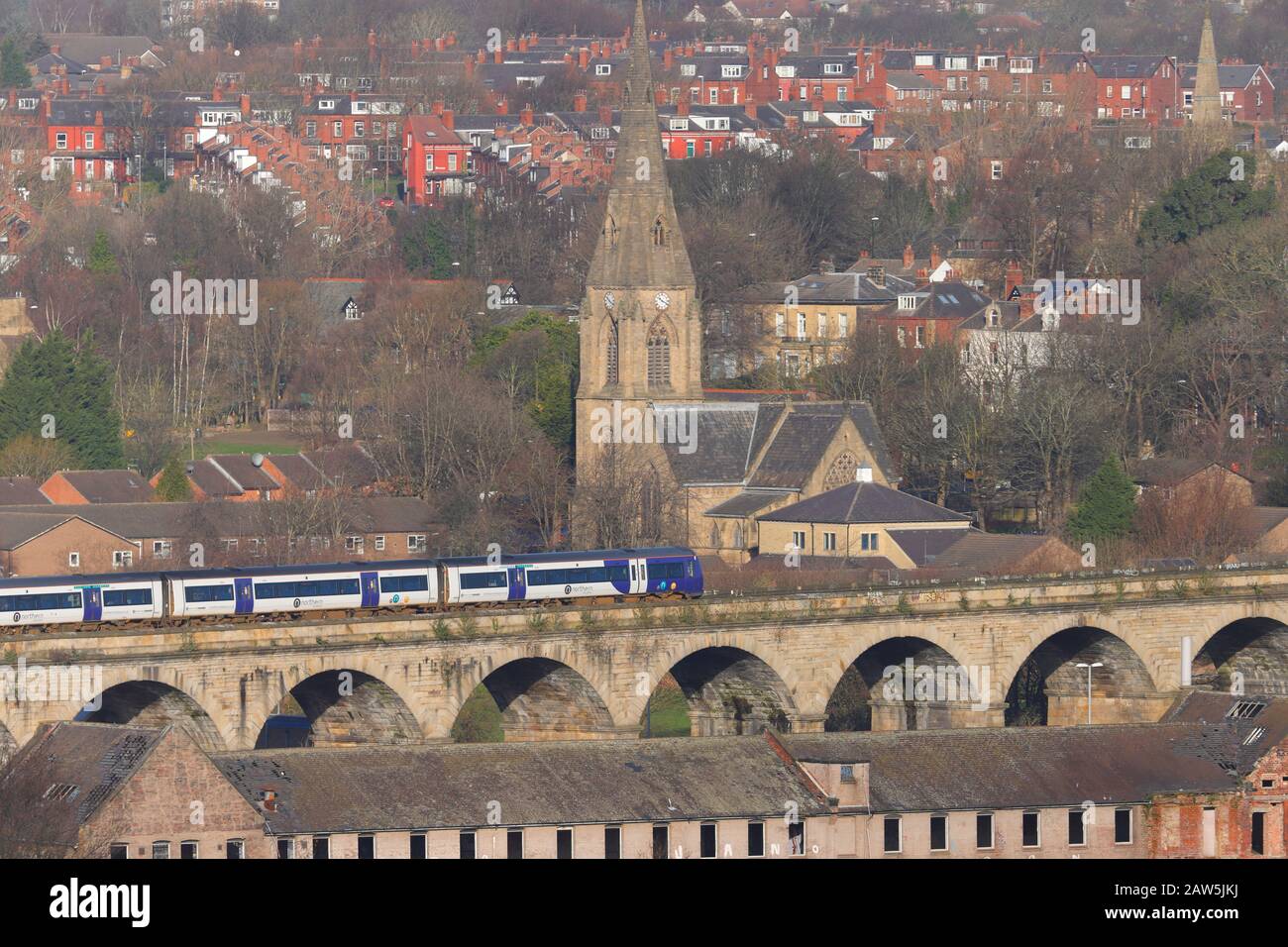 A Northern Rail passenger train travels over Kirkstall Viaduct in Leeds ...