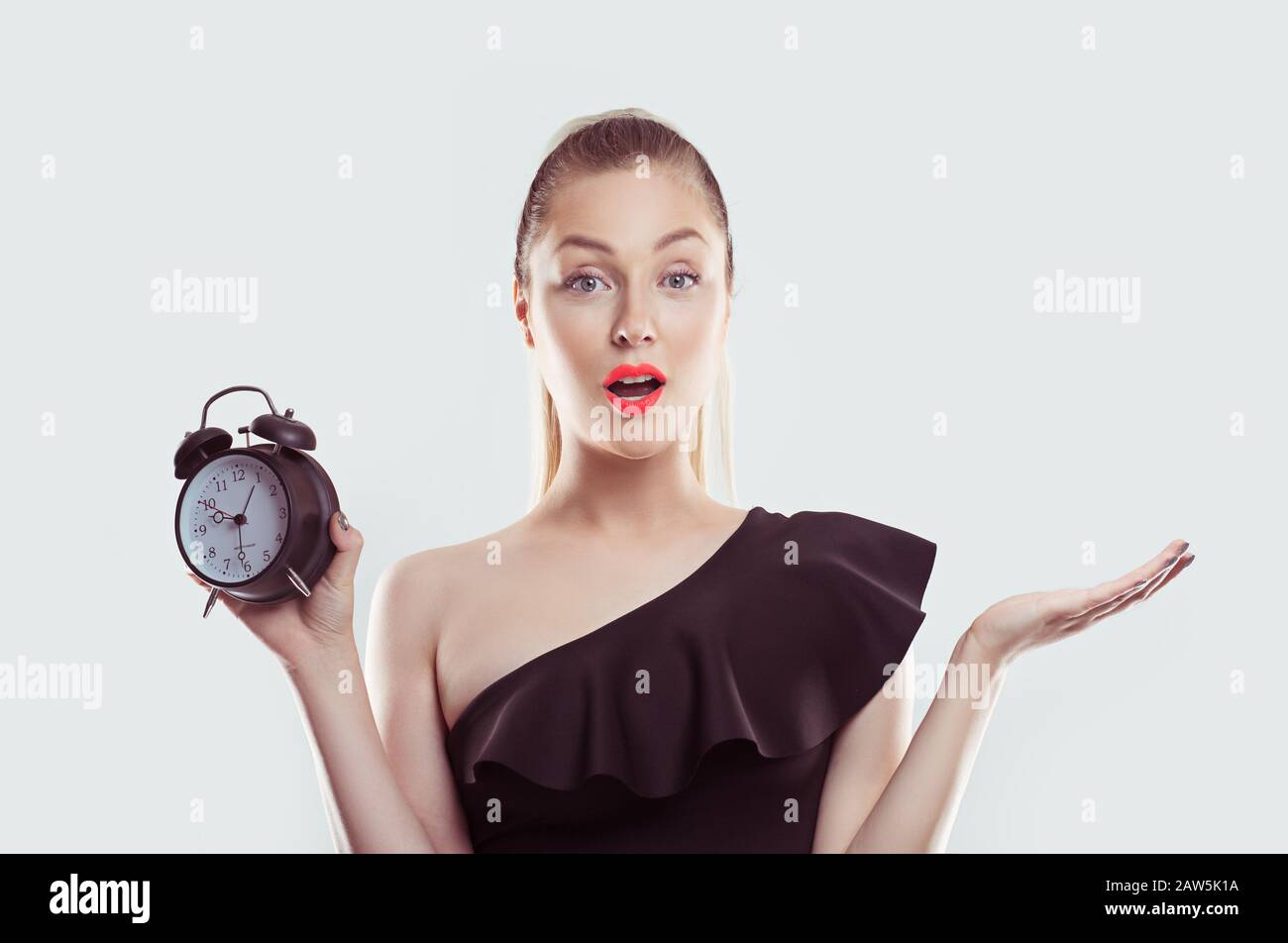 I am late, what to do now? Portrait of young surprised woman with alarm ...