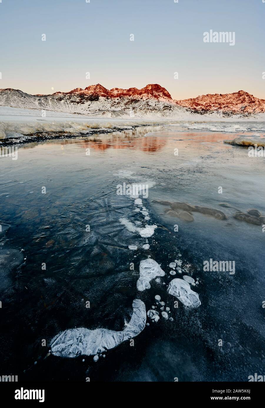 Coastline in covered with snow and ice natural landscape by lake ...