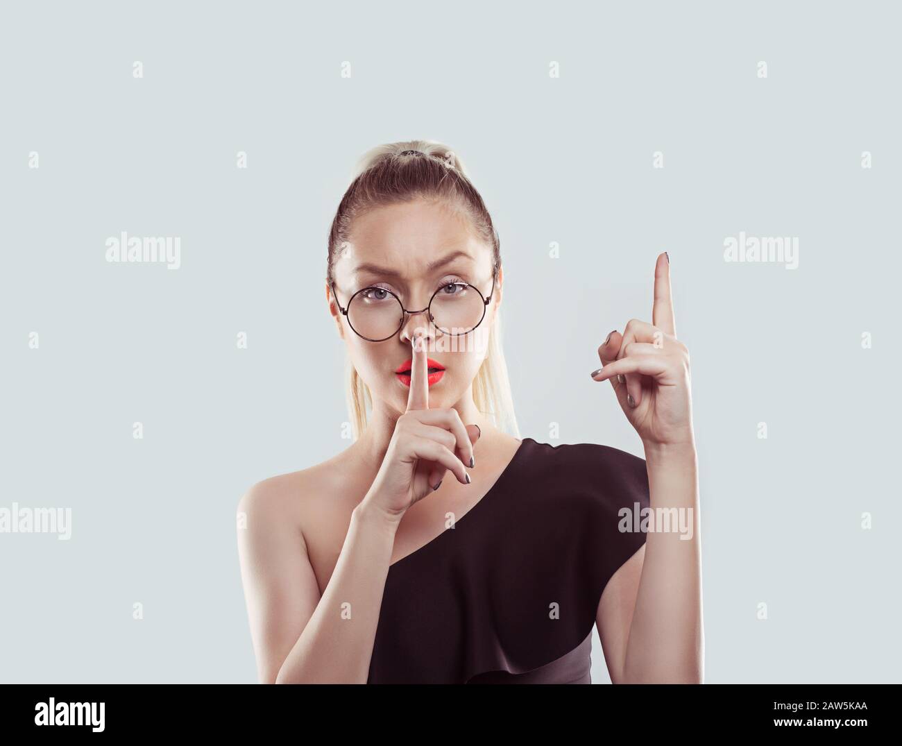 Woman asking for silence or secrecy with finger on lips hush hand ...