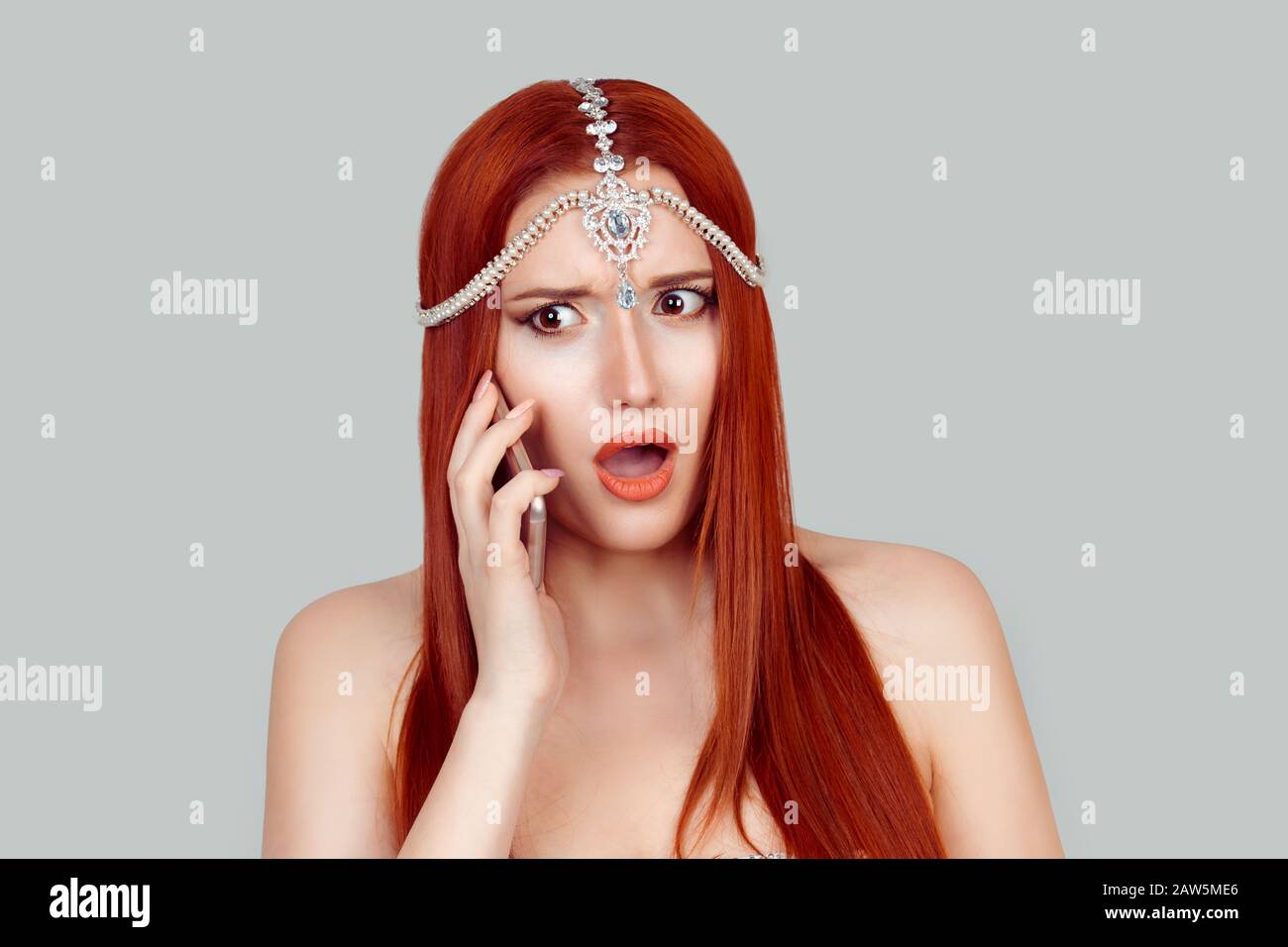 Shocking Phone talk. Shocked unhappy woman talking at mobile phone ...