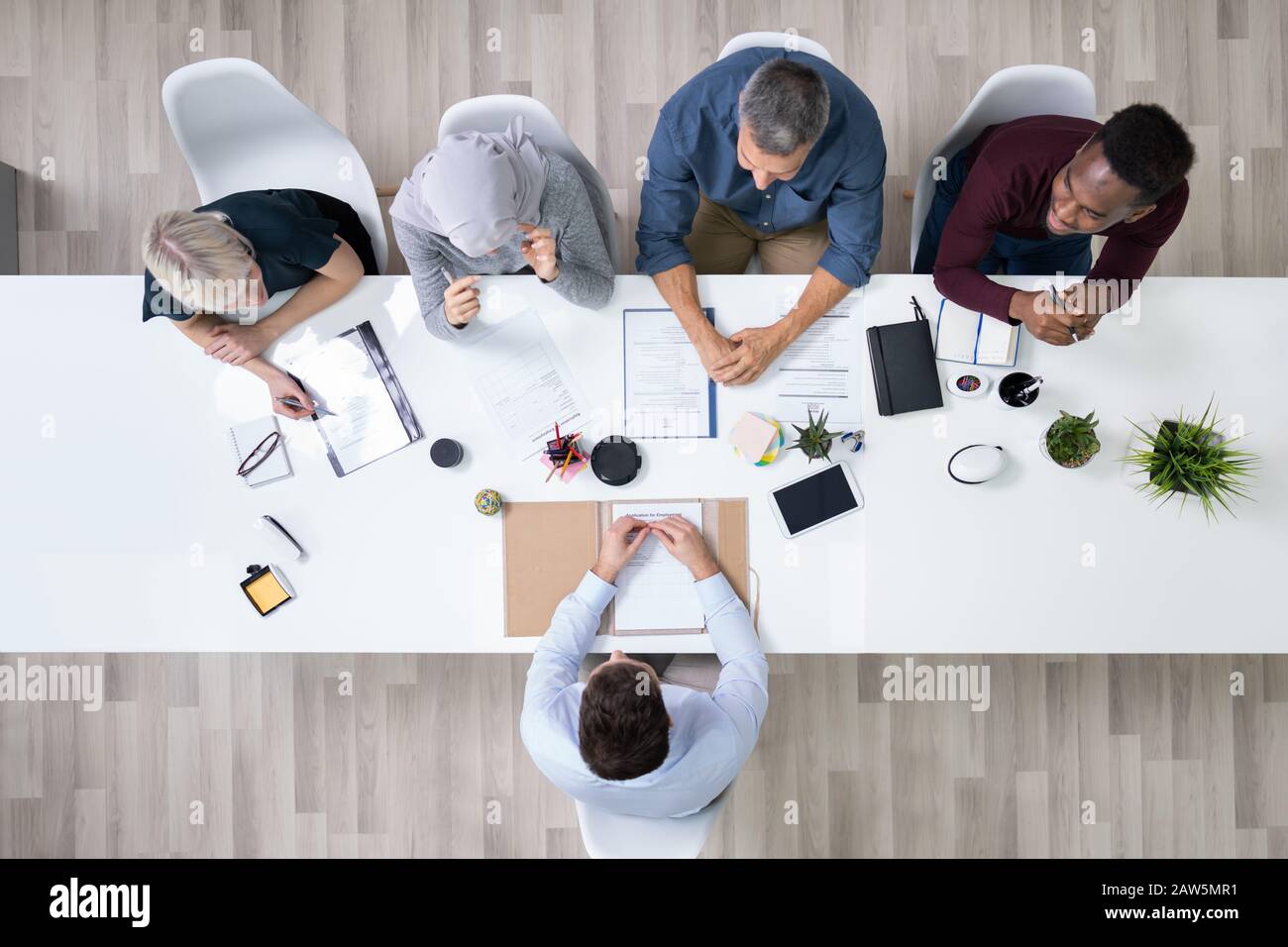 High Angle View Of Business People Taking An Interview In Office Stock ...