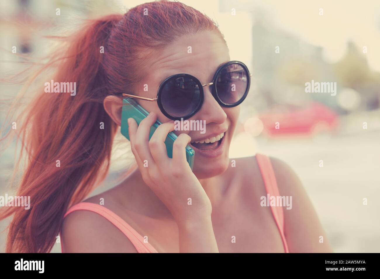 Portrait surprised laughing smiling screaming woman talking at phone on ...