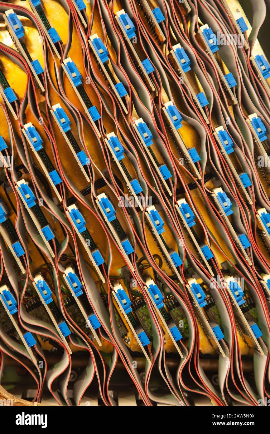Abstract image of circuit boards and ribbon cables at a particle ...