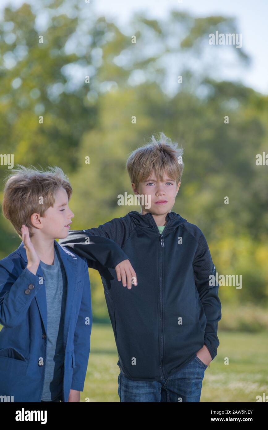 Portrait of two boys with a blurred background Stock Photo - Alamy