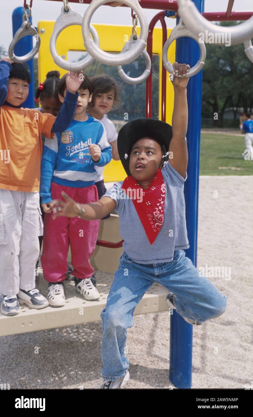Children taking turns playground hi-res stock photography and images ...