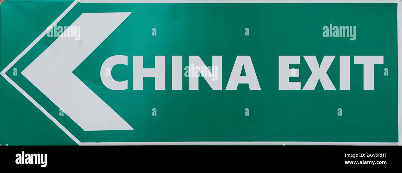 Green sign with white arrow illustrating direction to exit China Stock ...