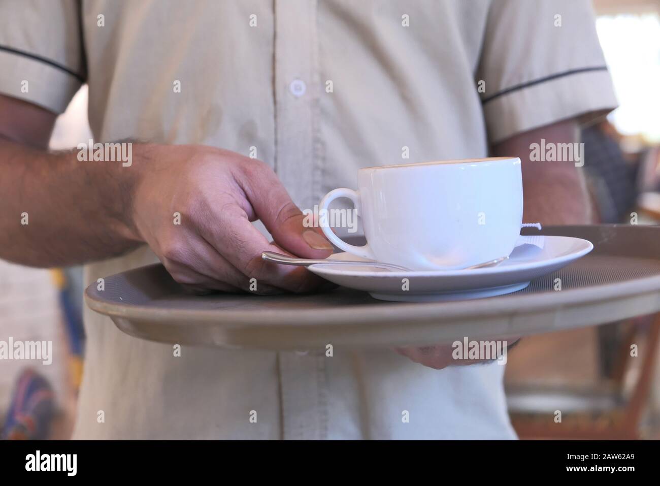 Man serving coffee hi-res stock photography and images - Alamy
