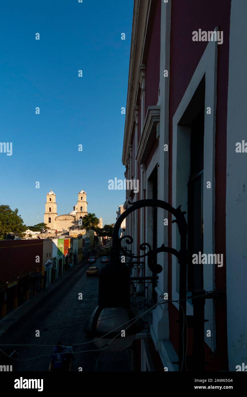 A city street shows a decorative lamp and colonial architecture with ...
