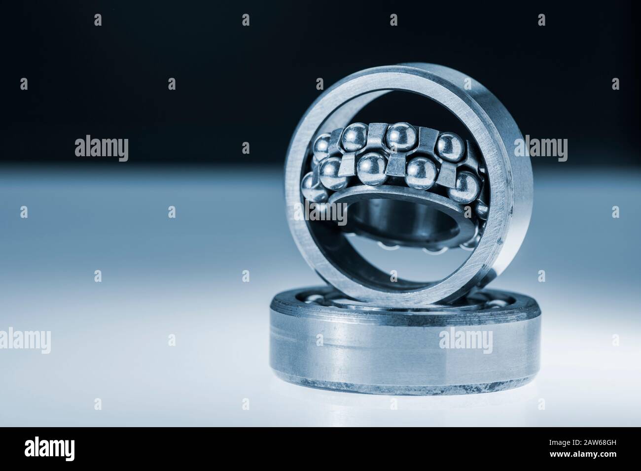 Close-up of two self-aligning ball bearings on top of each other ...