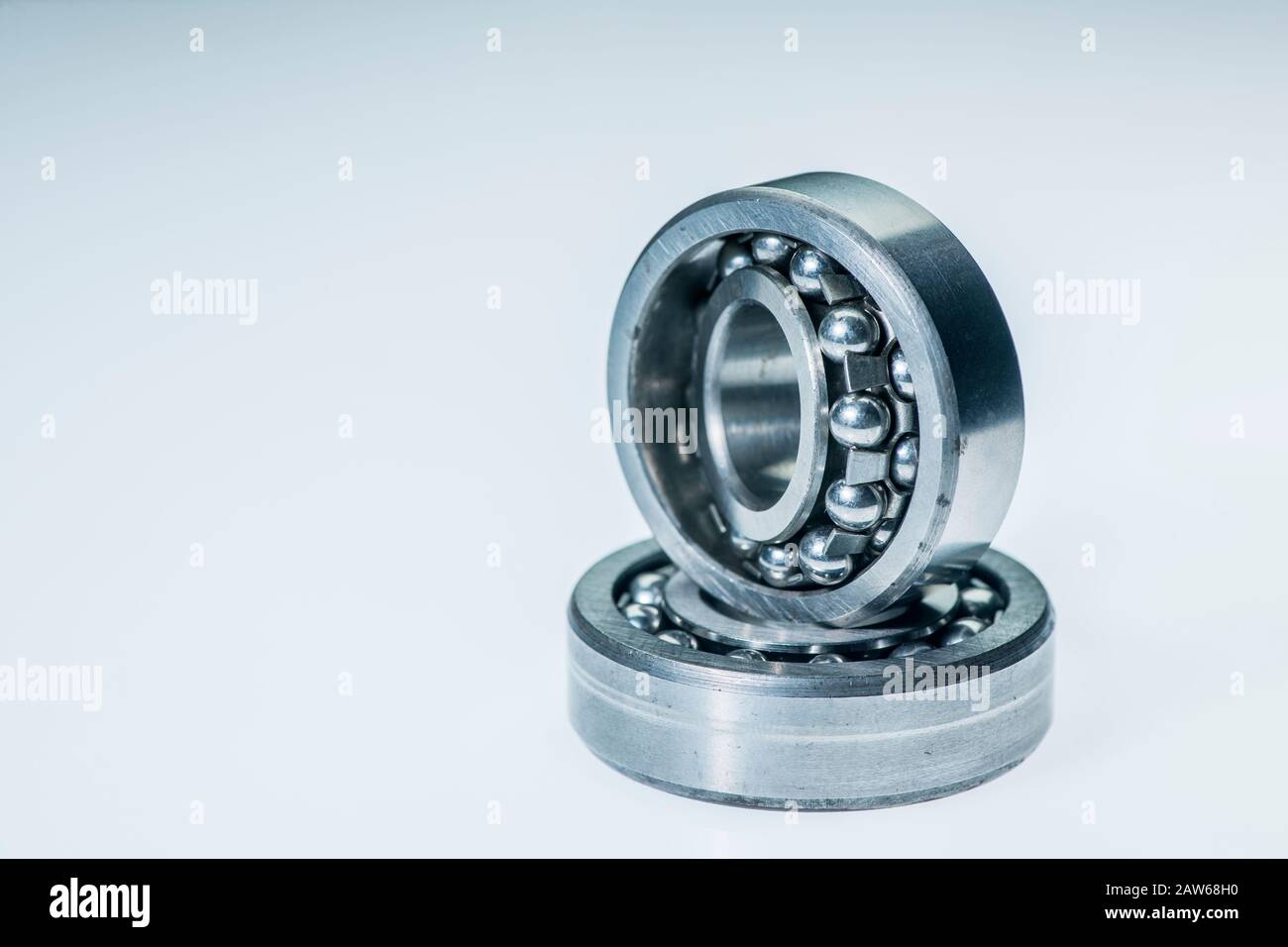 Close-up of two self-aligning ball bearings on top of each other ...