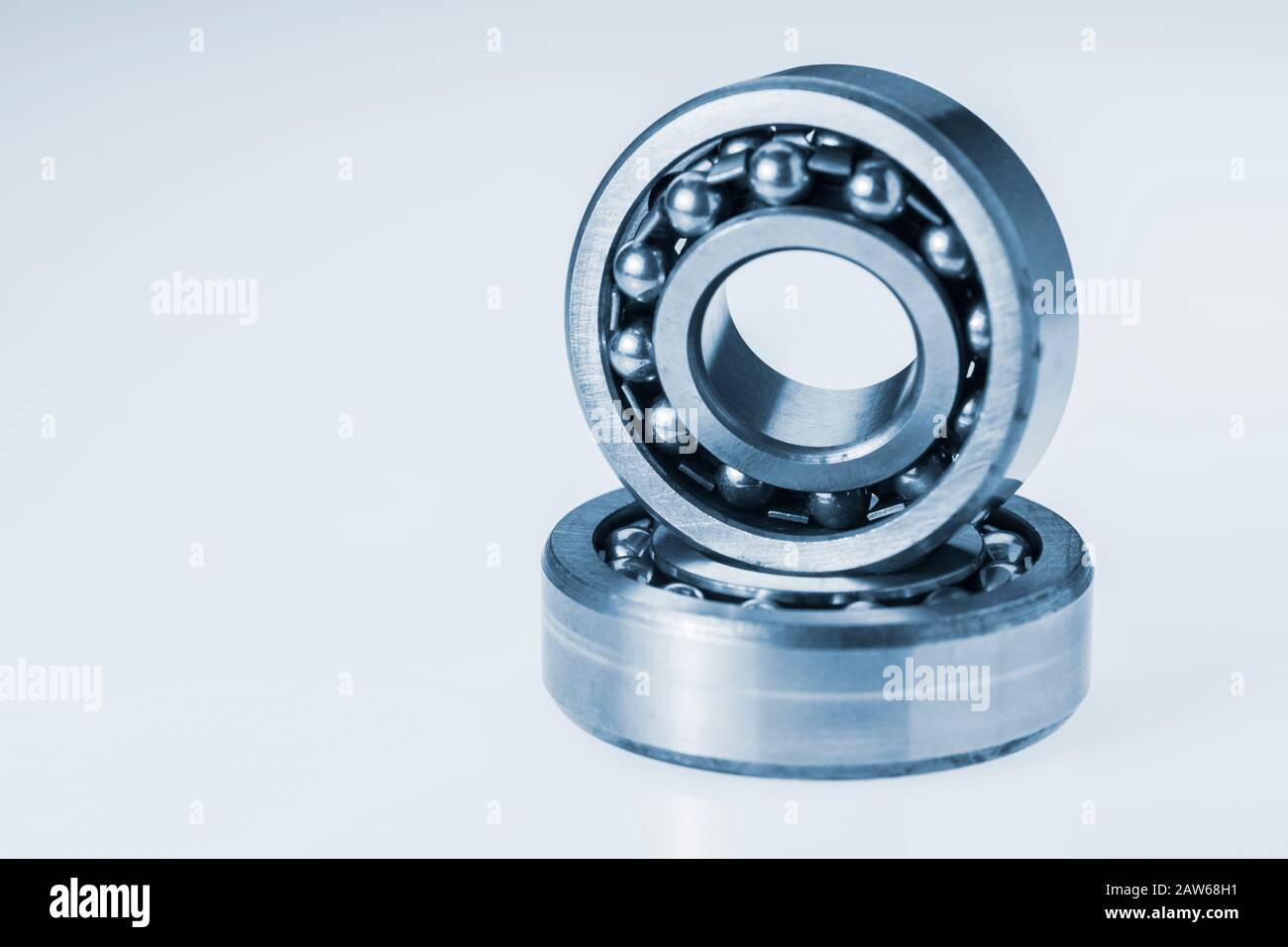 Close-up of two self-aligning ball bearings on top of each other ...