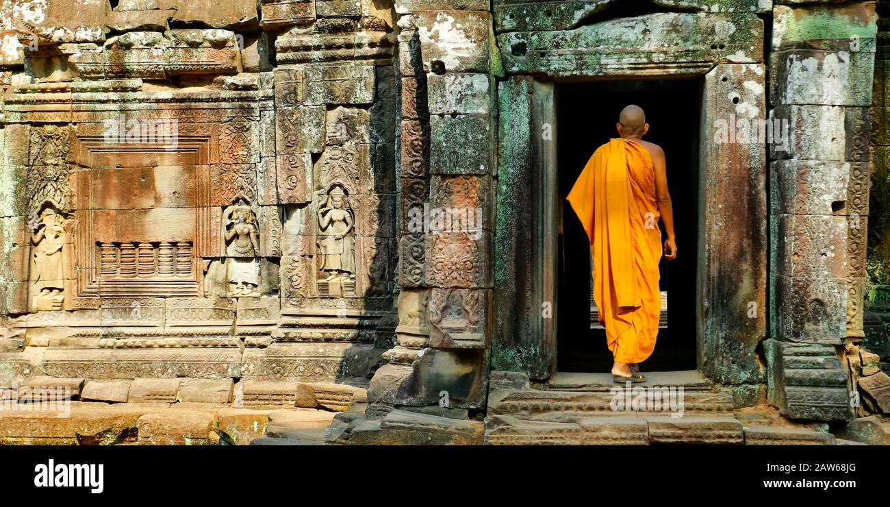 monk coming inside a temple in Angkor wat ,Cambodia Stock Photo - Alamy
