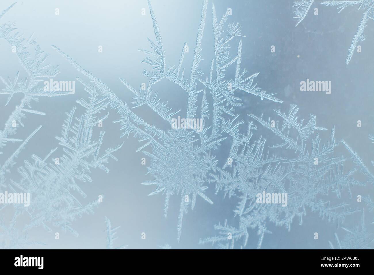 Frosty ice patterns on the window glass Stock Photo - Alamy