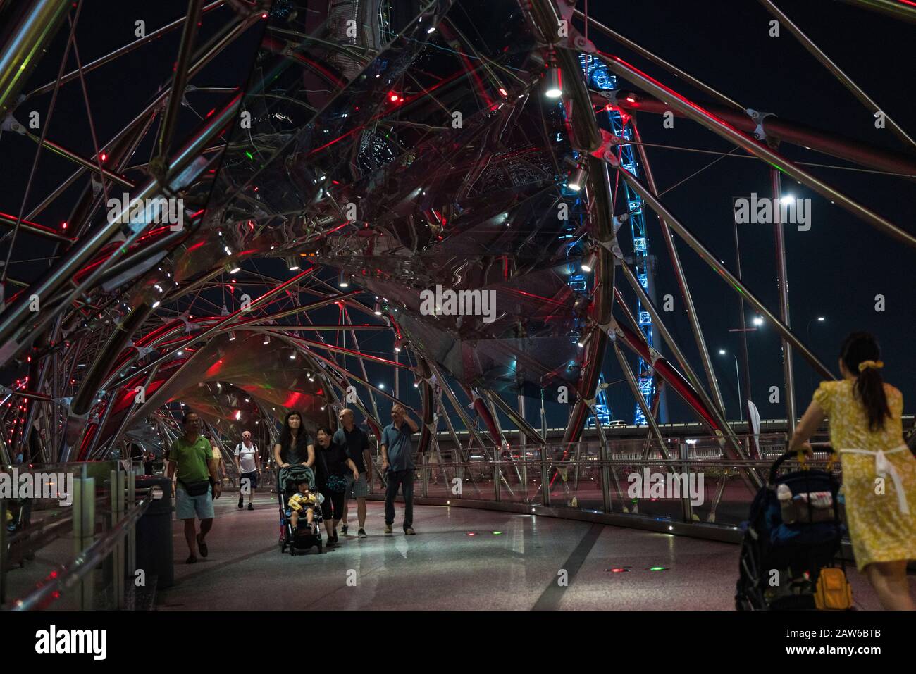 Singapore, April, 2019. The Helix Bridge at night, officially The Helix ...