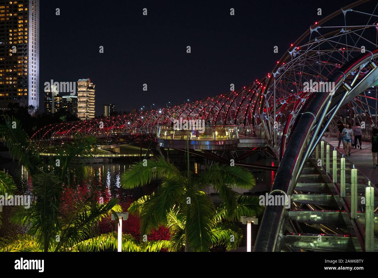 Singapore, April, 2019. The Helix Bridge at night, officially The Helix ...