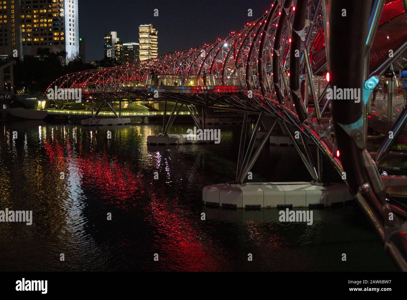 Singapore, April, 2019. The Helix Bridge at night, officially The Helix ...