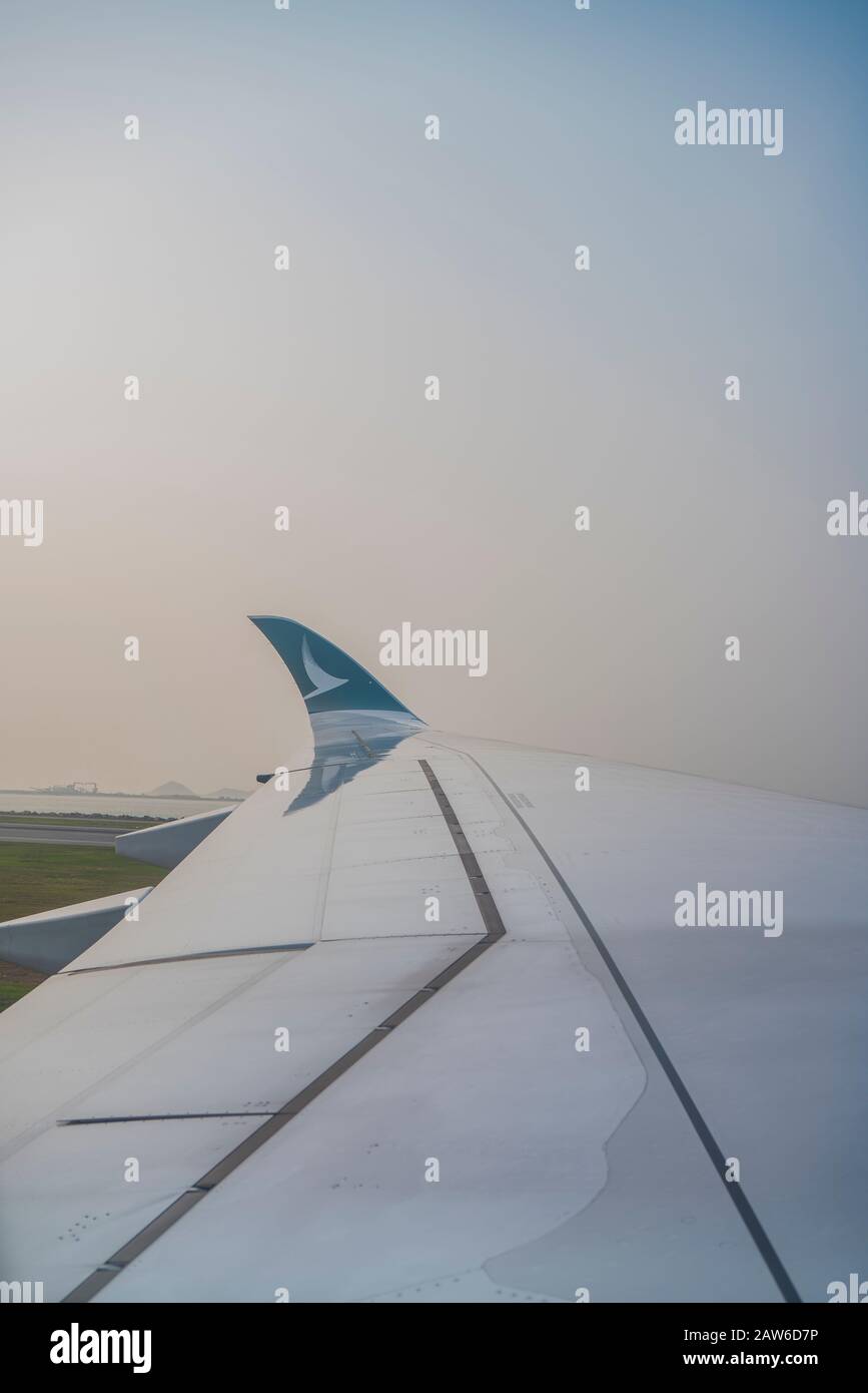 Singapore, April, 2019. The wing seen from the airplane window. Cathay ...