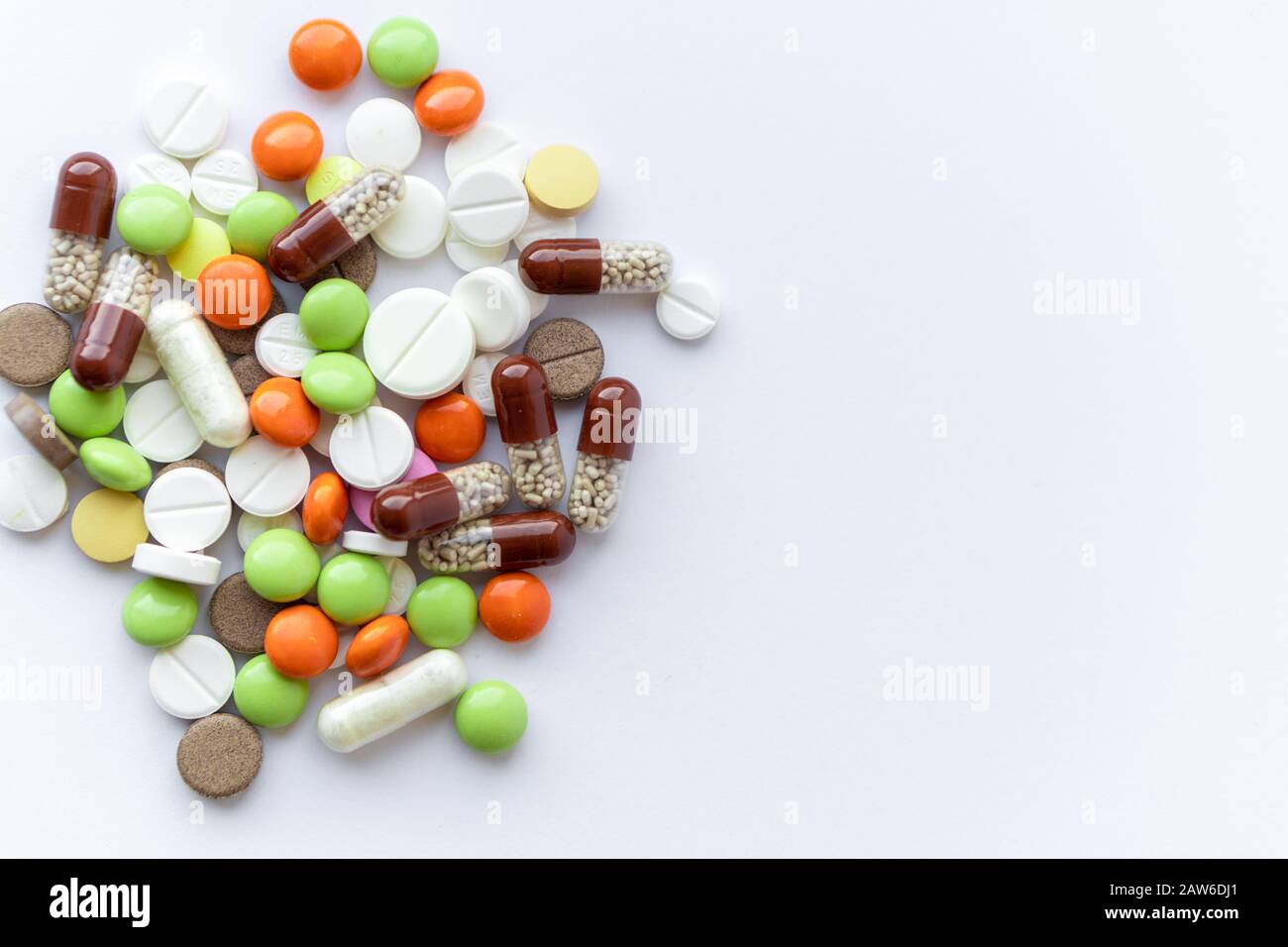 Medicines and pills. Multicolored medicines on a white background close ...