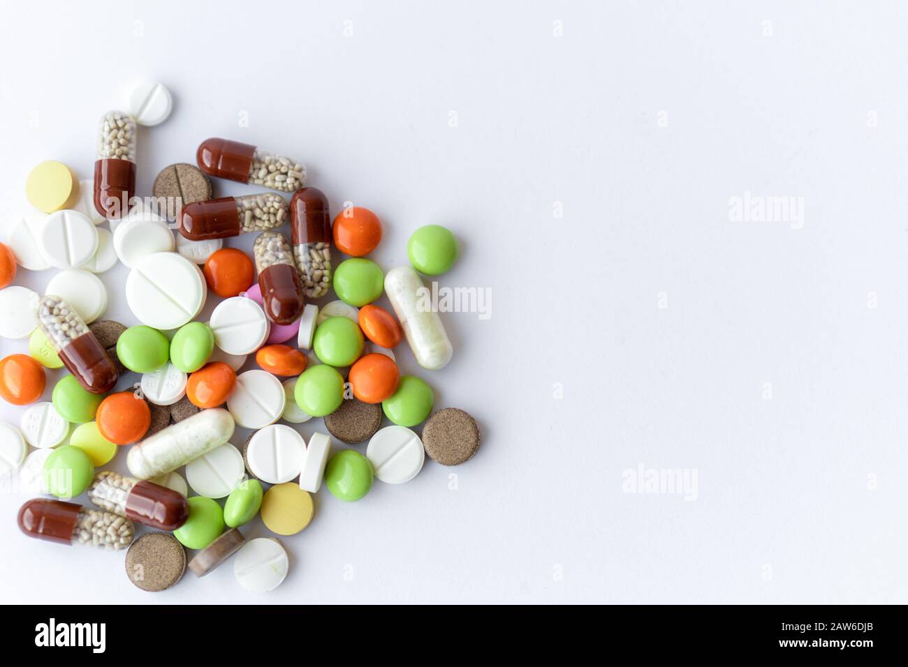 Medicines and pills. Multicolored medicines on a white background close ...