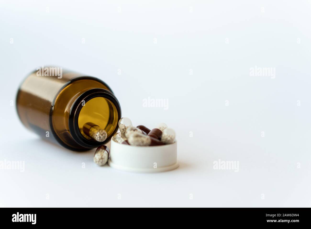 Medicine and pills. Medicines on a white background close-up. Brown ...