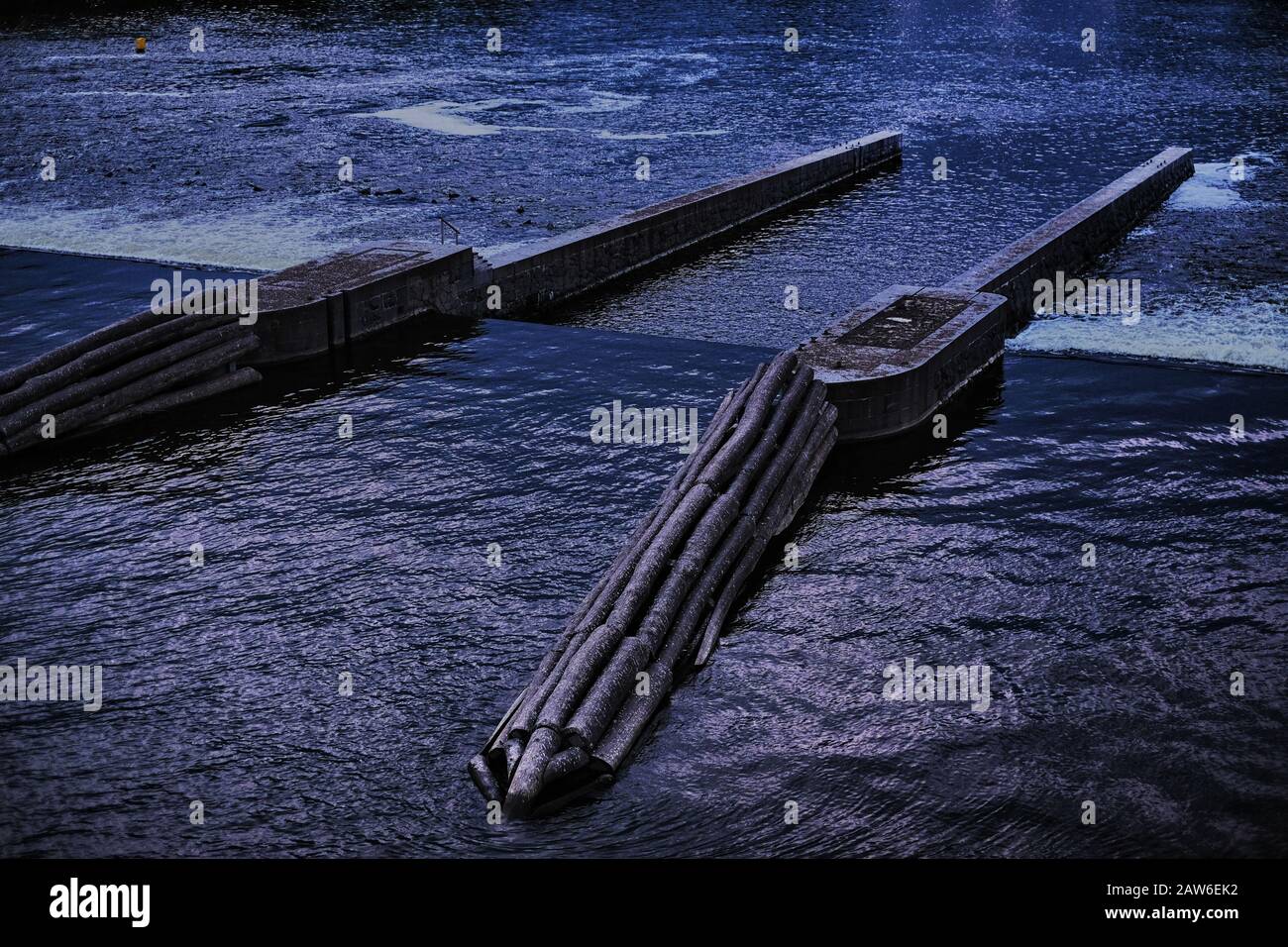 A concrete weir and channels controlling water flow on the river Vltava ...