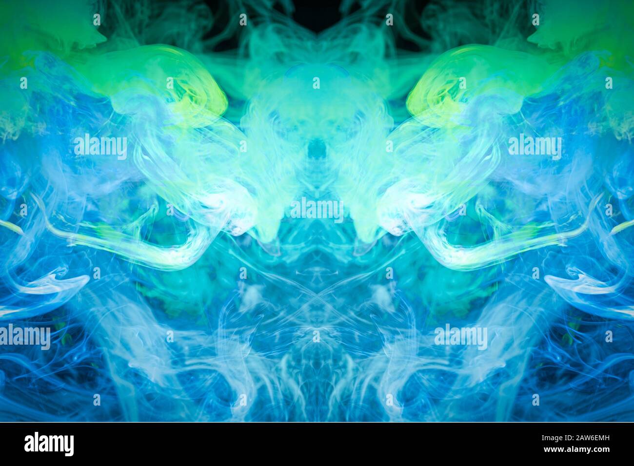 Dense multicolored smoke of blue and green colors in the form of a ...