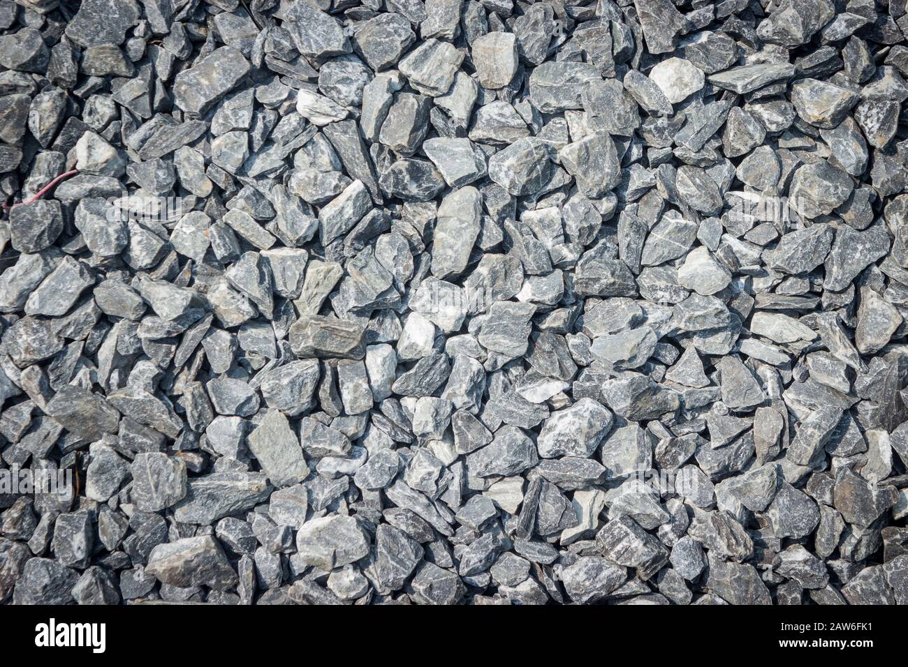 Gravel gray small rock and stone texture background Stock Photo - Alamy