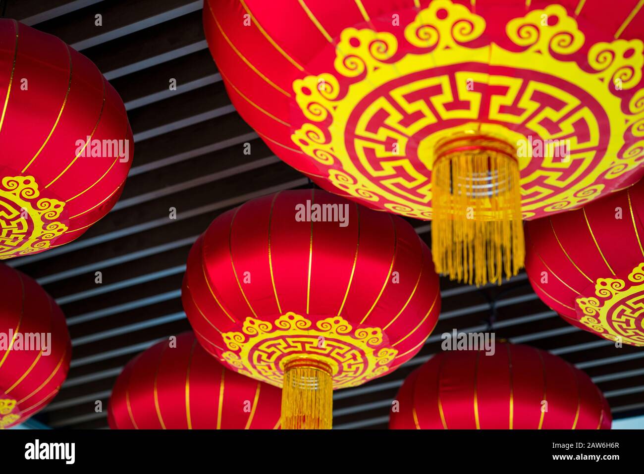 The big red lanterns are hanging on the ceiling Stock Photo - Alamy