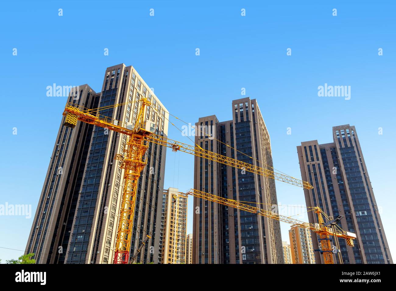 Building construction site, tall skyscrapers and cranes Stock Photo - Alamy