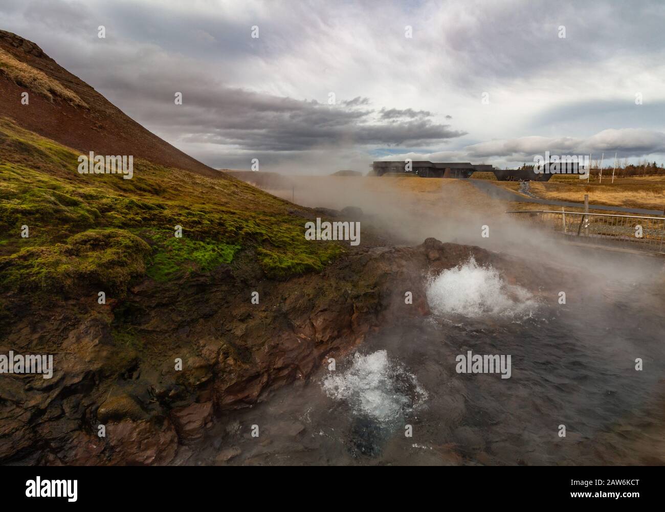 Beautiful volcanic hot springs next to a mountain cliff in Iceland ...