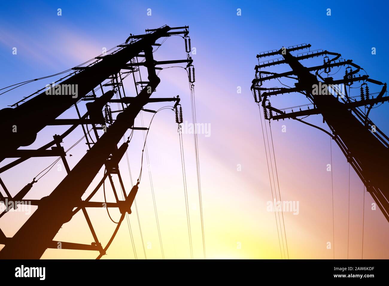 High voltage electricity poles and dusk sky Stock Photo - Alamy