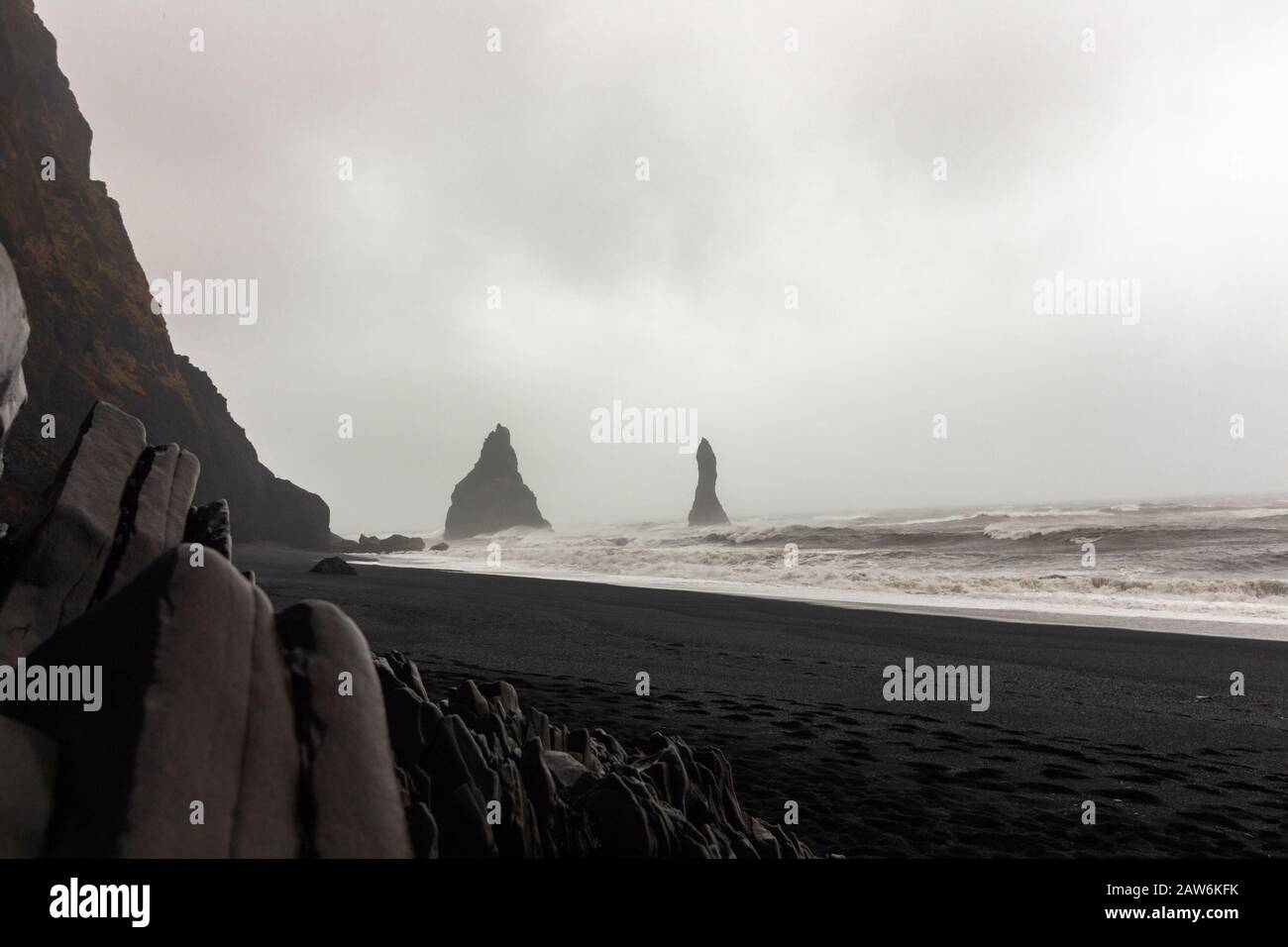 Reynisfjara black sand beach and landmark of Vik town in Iceland ...