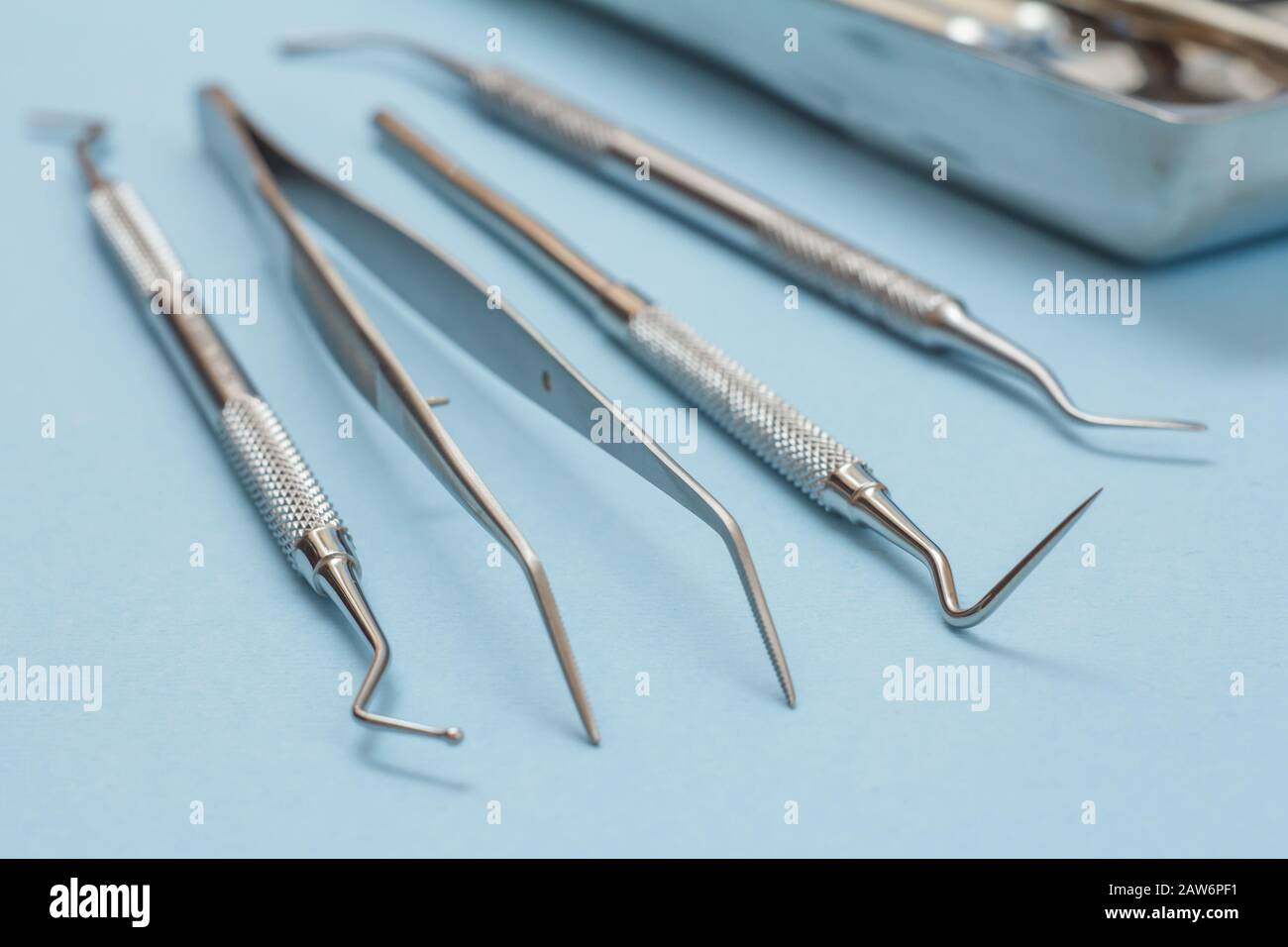 Set of metal dental instruments for dental treatment. Dental plugger ...