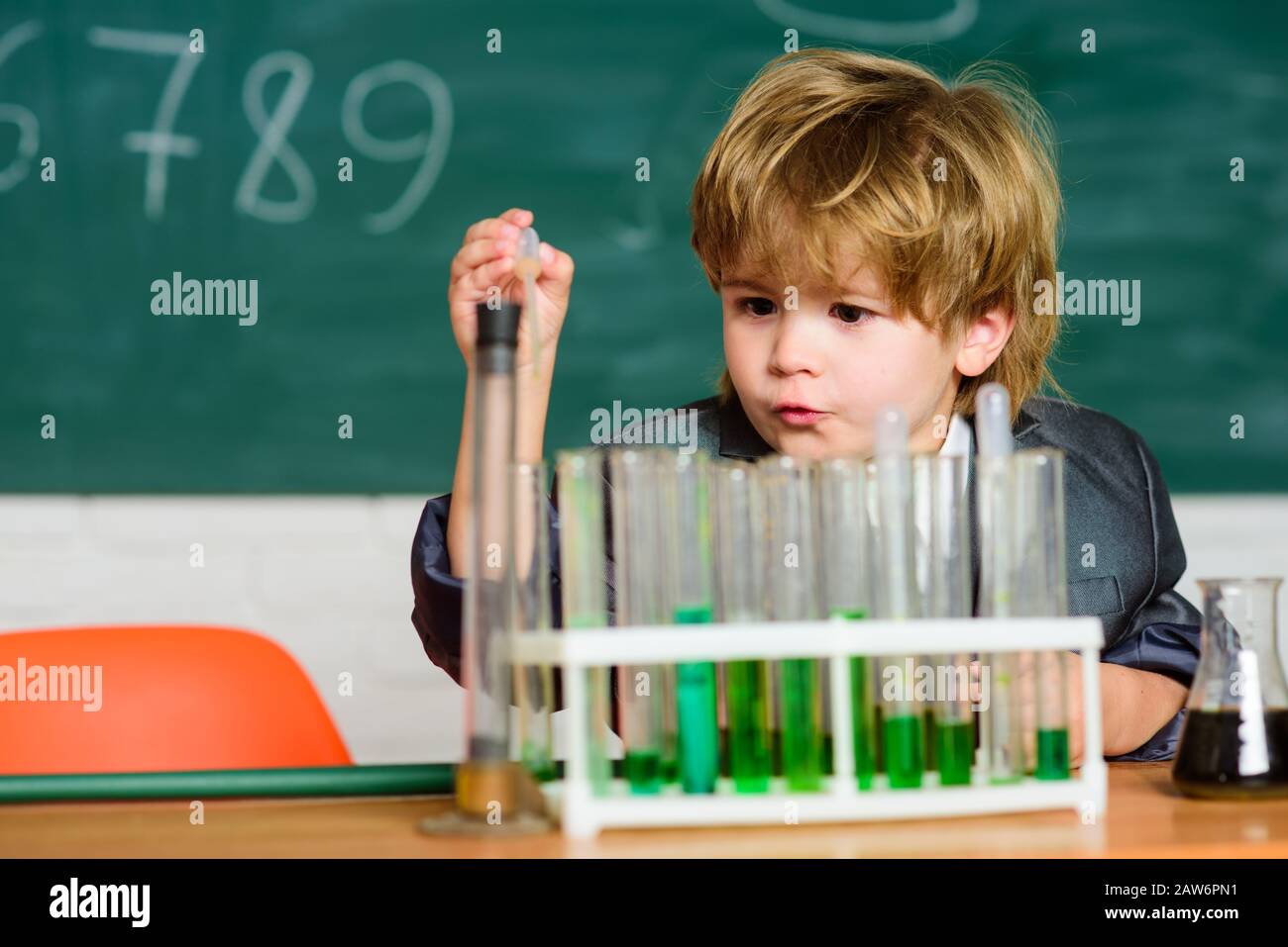 experimenting with chemicals kid in lab coat learning chemistry ...