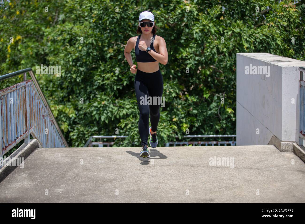 Asian women Running and jogging during outdoor on city run Stock Photo ...