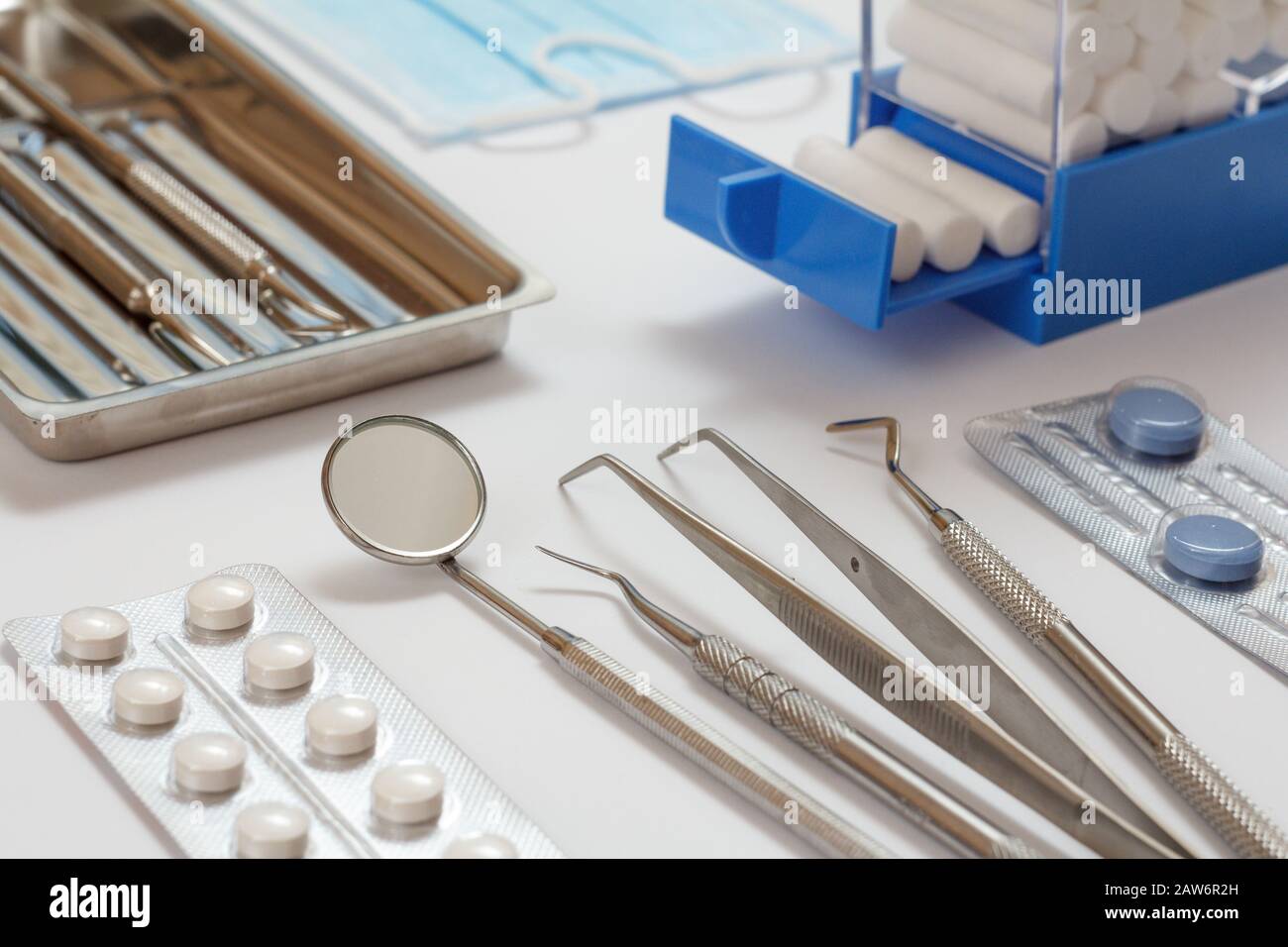 Set of dental instruments for dental treatment on white background ...