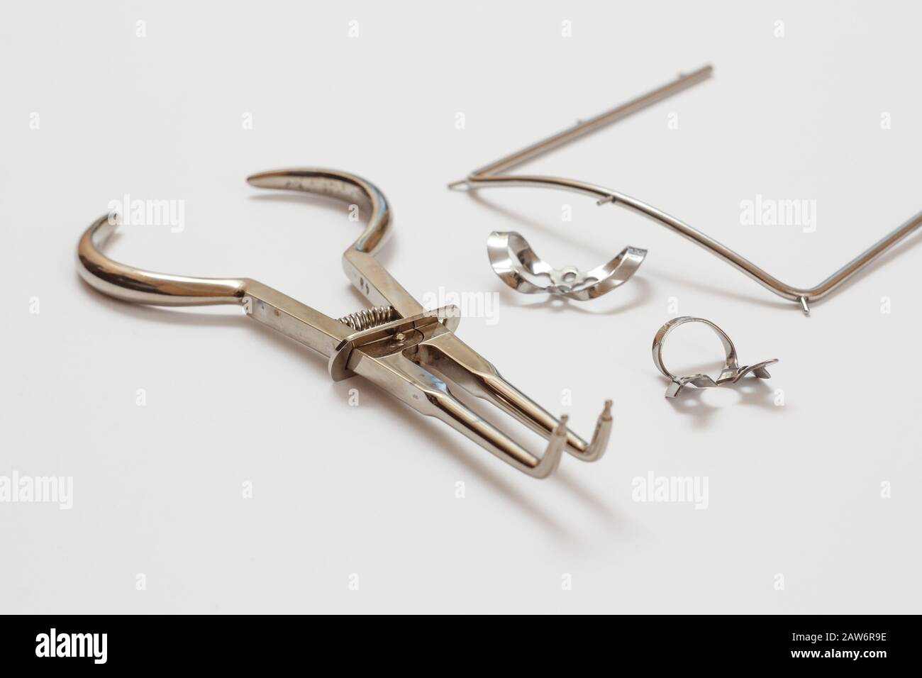 Metal instrument for dental treatment. Dental tongs, clasps and ...