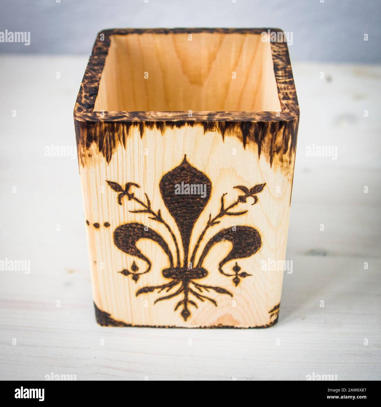 the ancient art of pyrography, wood and fire, the symbols of the city ...