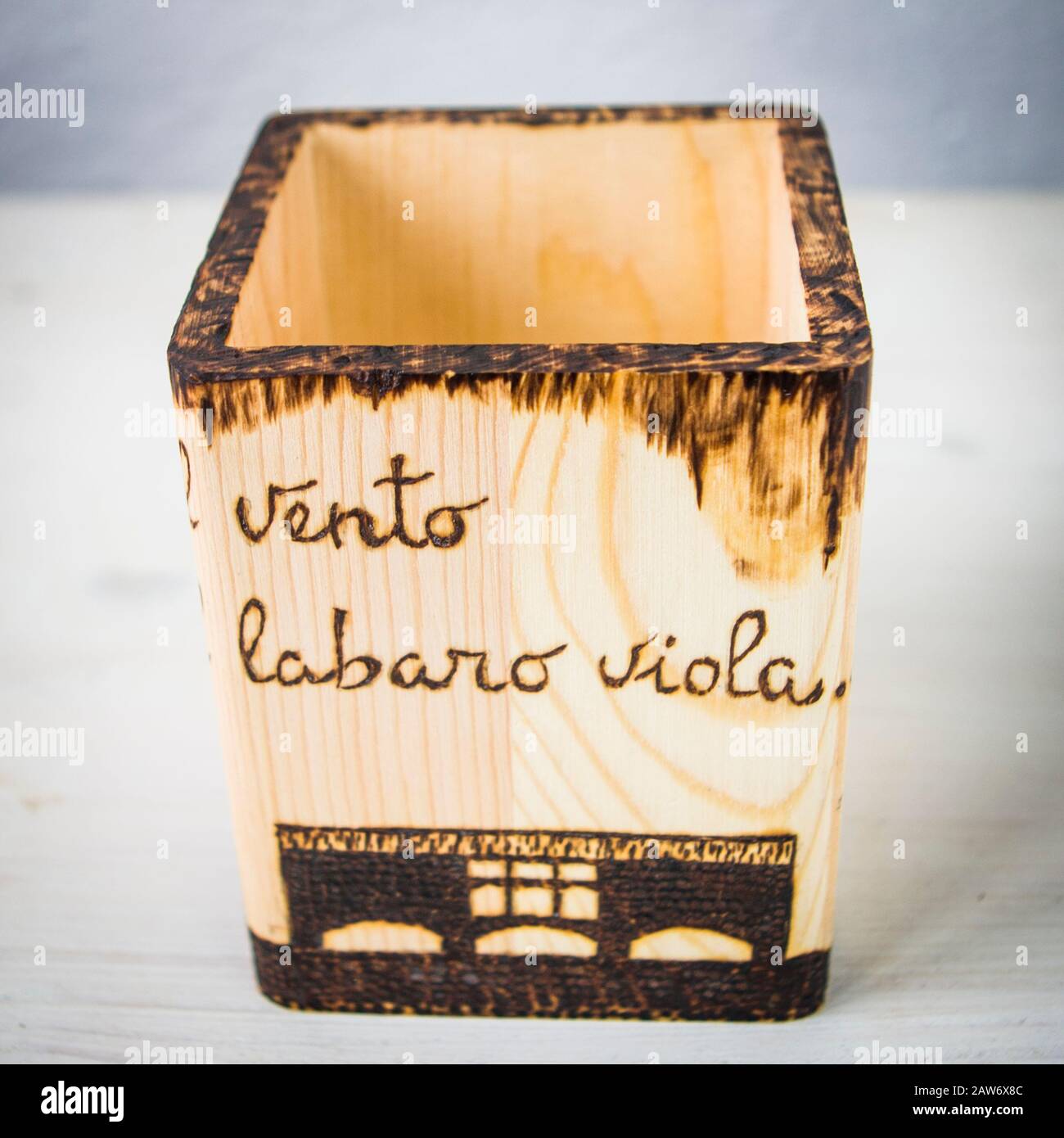 the ancient art of pyrography, wood and fire, the symbols of the city ...