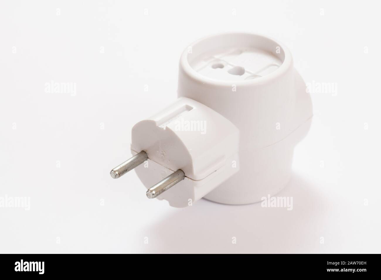 Plastic electrical tee connector with three sockets on a white ...