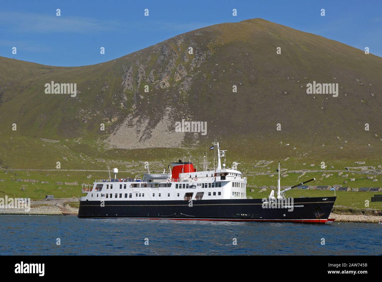 HEBRIDEAN PRINCESS at anchor underneath the highest point of the island ...